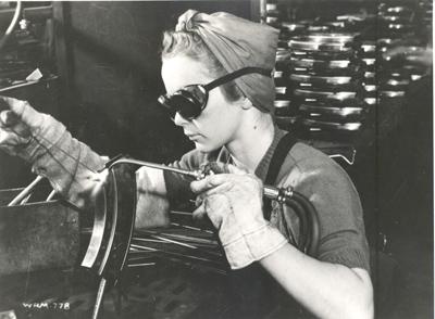 Ethel Mitchell doing light welding on a Bren Gun magazine